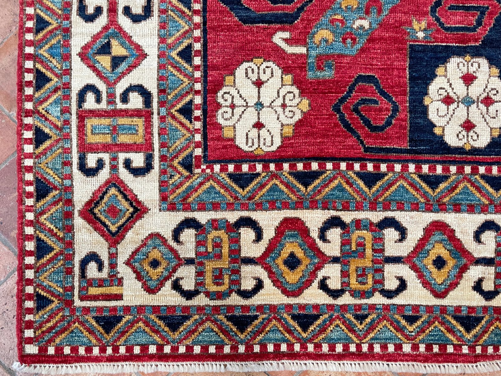 Pinwheel Kazak design rug - Farnham Antique Carpets